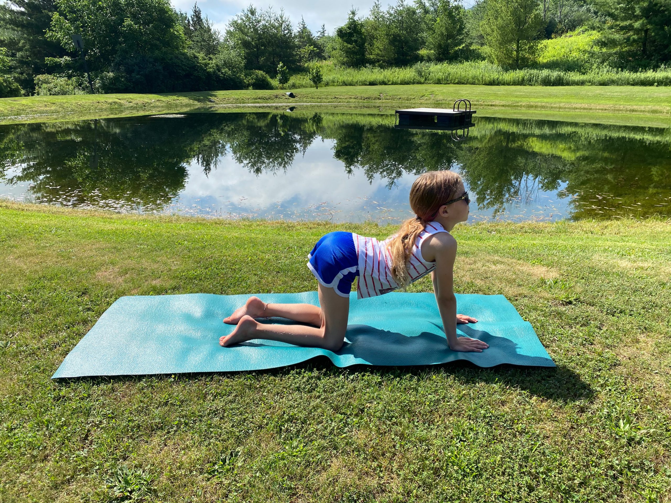Little Girl Doing Cat Cow Pose Little Girl Doing Cat Cow Pose